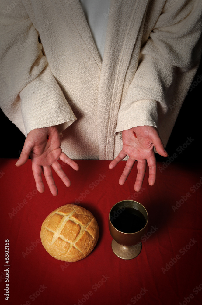 Jesus hands with scars ofering the Communion elements Photos | Adobe Stock