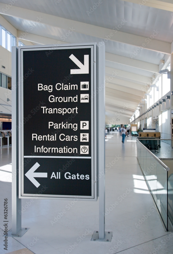 Direction signs in an airport terminal for travelers Stock Photo ...