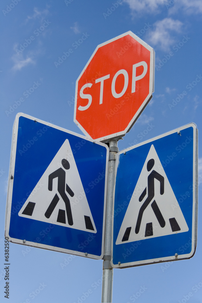 Road sign with stop and crosswalk pedestrian symbols warning Stock ...