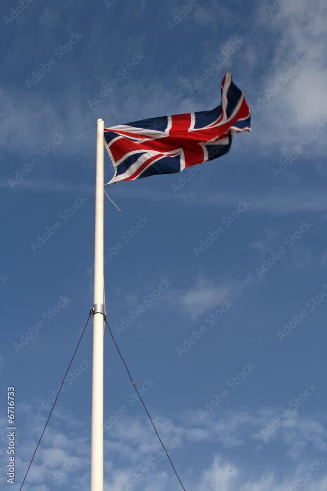 union jack flag flapping in the wind ontop of flag pole Stock Photo ...