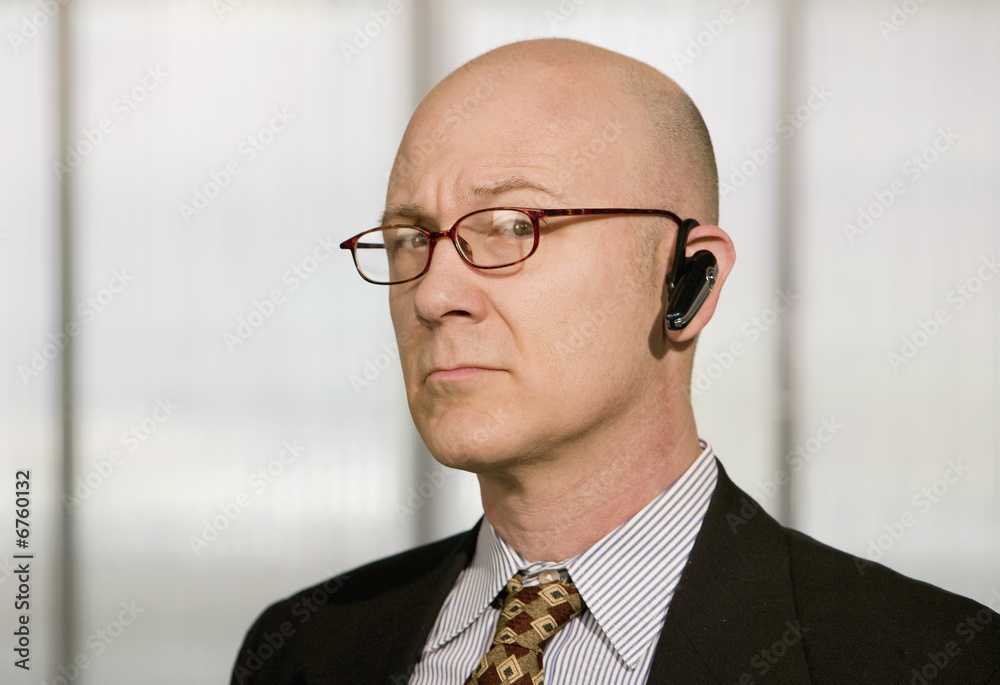 Businessman With A Hands free Phone Stock Adobe Stock businessman-with-a-hands-free-phone-stock-adobe-stock