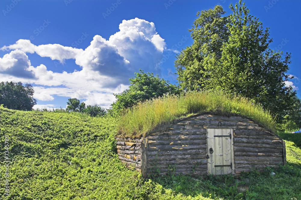 Ancient earth house near medieval Russian fortress Stock Photo | Adobe ...