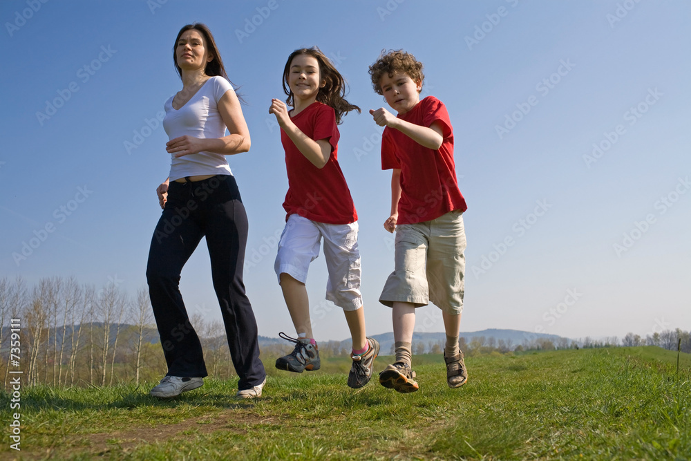 Mother with kids running Stock Photo | Adobe Stock