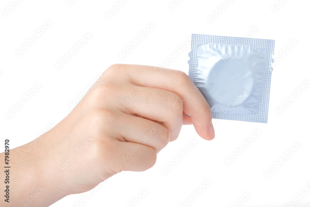 Hand holding a condom isolated on white background. Stock Photo | Adobe Stock
