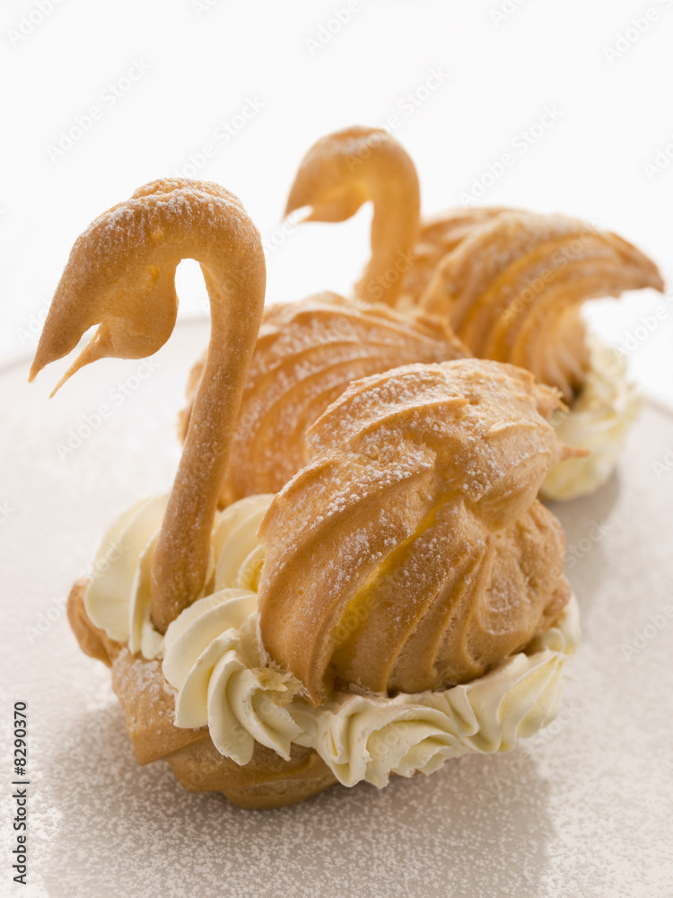 Two Choux Pastry Swans filled with Cream Stock Photo | Adobe Stock