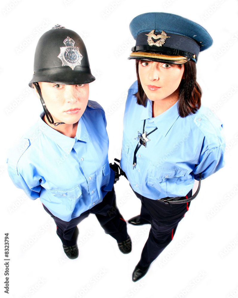 overhead view beautiful brunette and blonde police woman Stock Photo ...