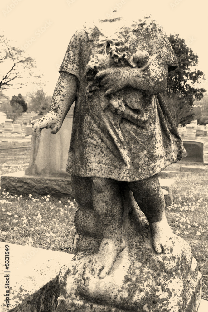 Headless statue in graveyard. Stock Photo | Adobe Stock