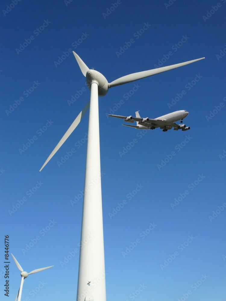 Windrad mit Flugzeug Stock Photo | Adobe Stock