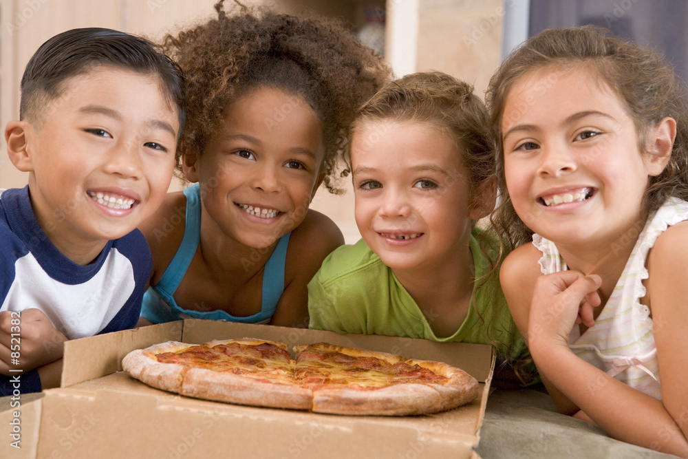 Four young children with pizza smiling Stock Photo | Adobe Stock