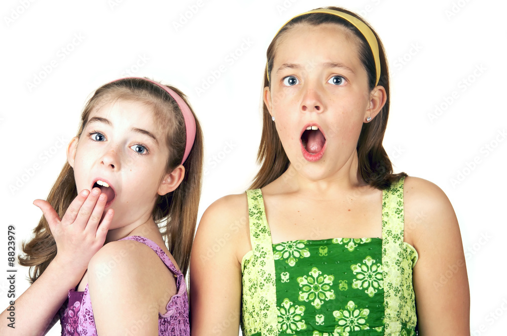 Two cute little girls with a surprised look on their faces Stock Photo ...