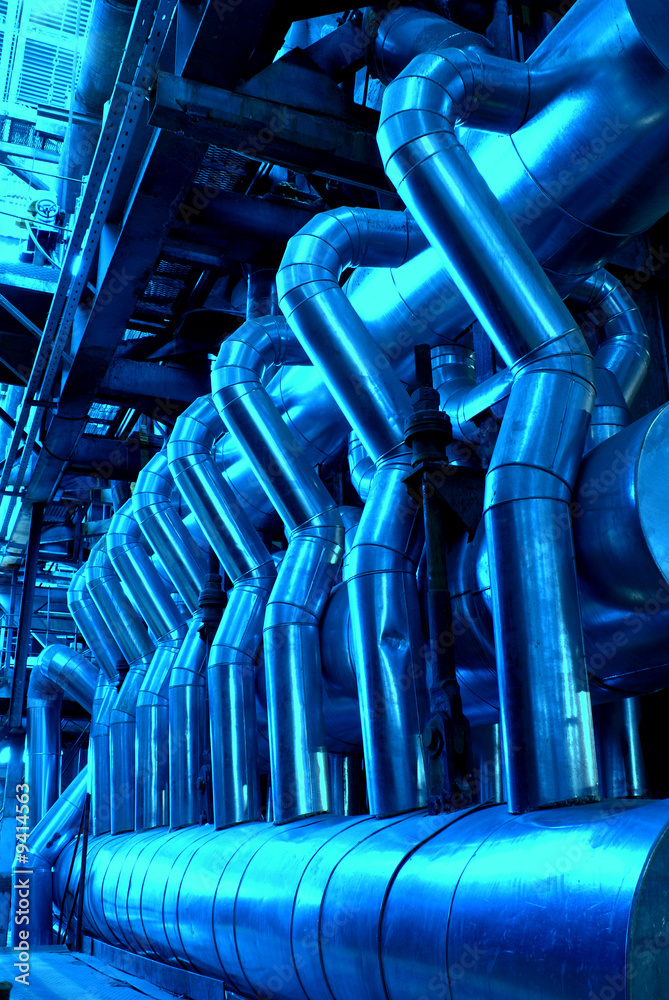 Pipes, tubes, machinery and steam turbine at a power plant Stock Photo ...