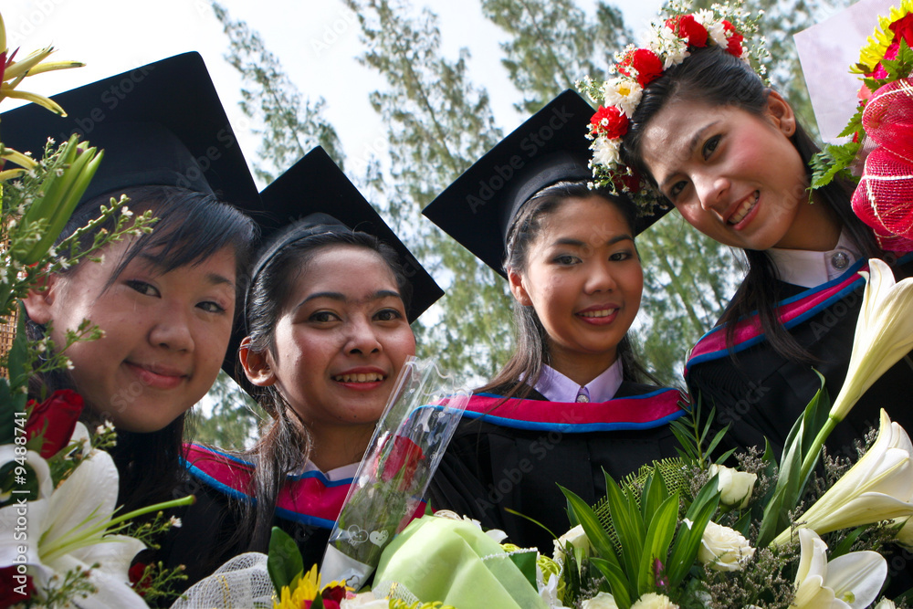 Beautiful Asian university graduates celebrate their success. Stock ...