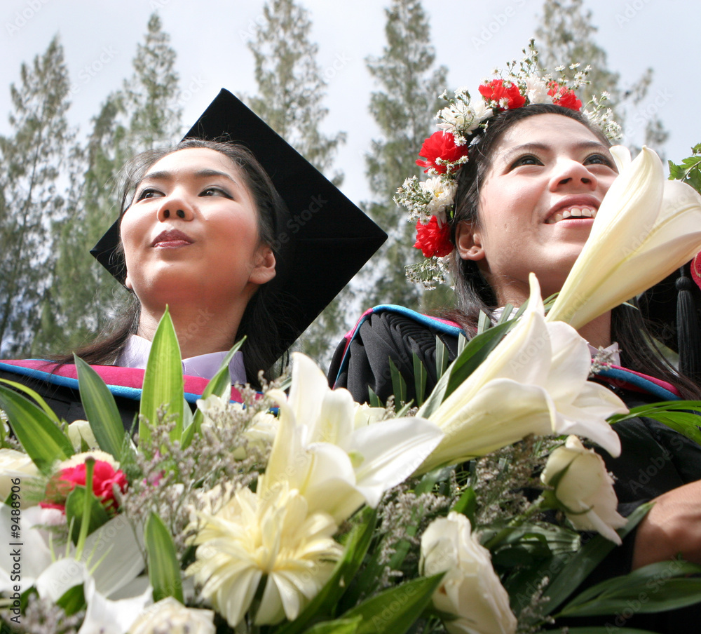 Beautiful Asian university graduates celebrate their success. Stock ...