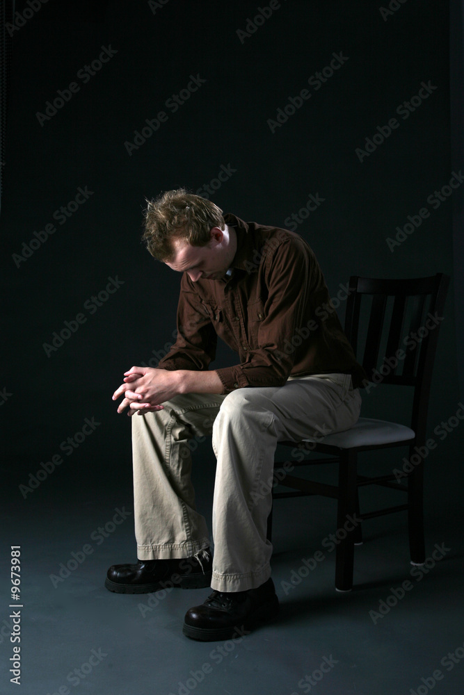 Sad Man Sitting In Chair