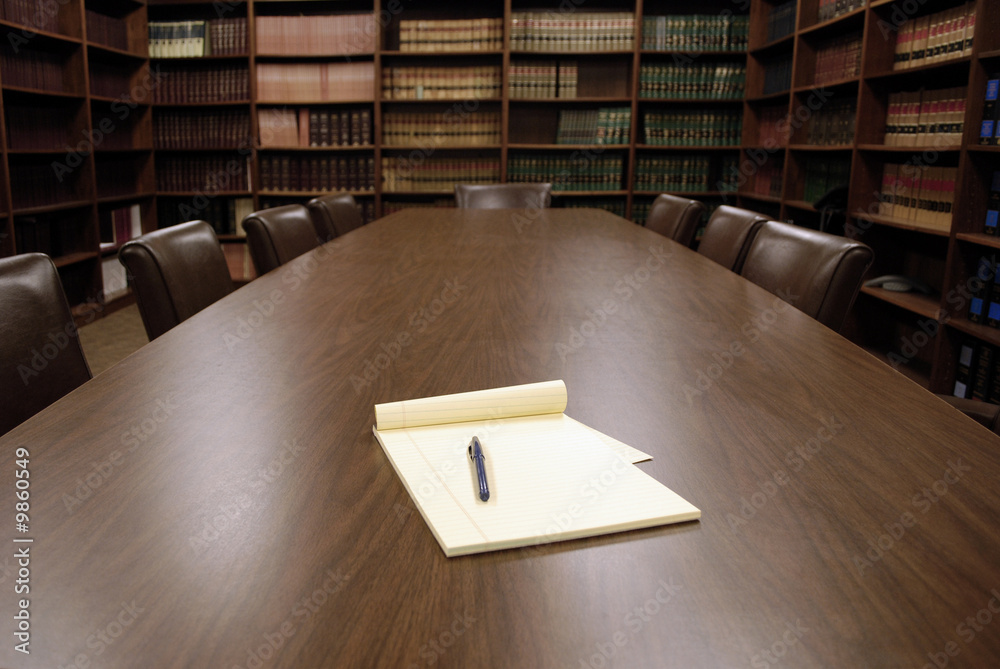 Conference room table and shelves of books Stock Photo | Adobe Stock