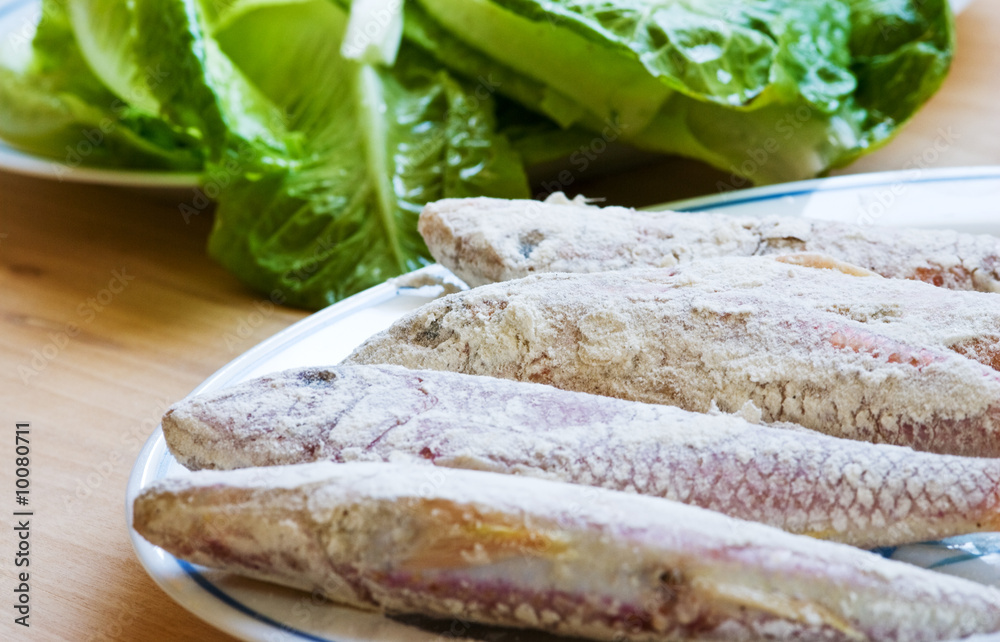 Red Mullets with flour ready to be cooked. Stock Photo | Adobe Stock