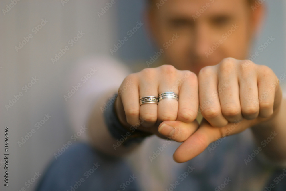 Detail of man's hand's wearing silver rings Stock Photo | Adobe Stock