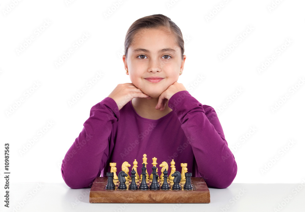 Attractive little girl playing chess Stock Photo | Adobe Stock