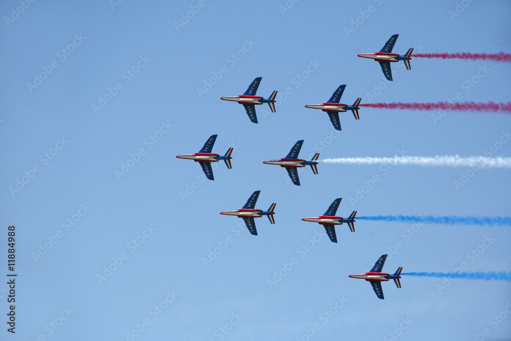 Formation of jet planes with coloured smoke trails Stock Photo | Adobe ...