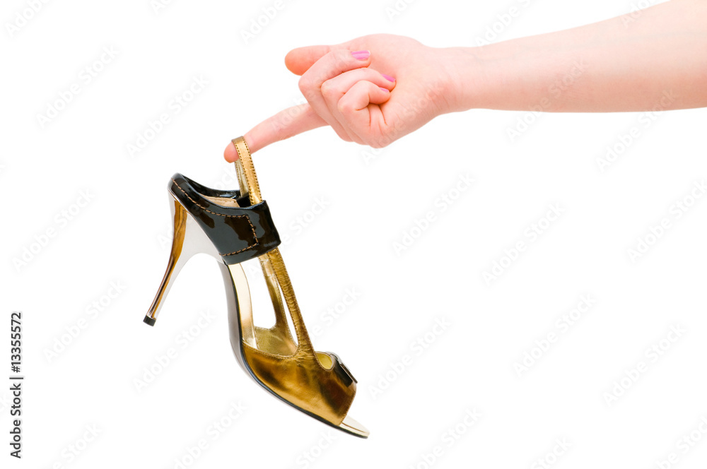 Hand holding woman shoe isolated on white Stock Photo | Adobe Stock