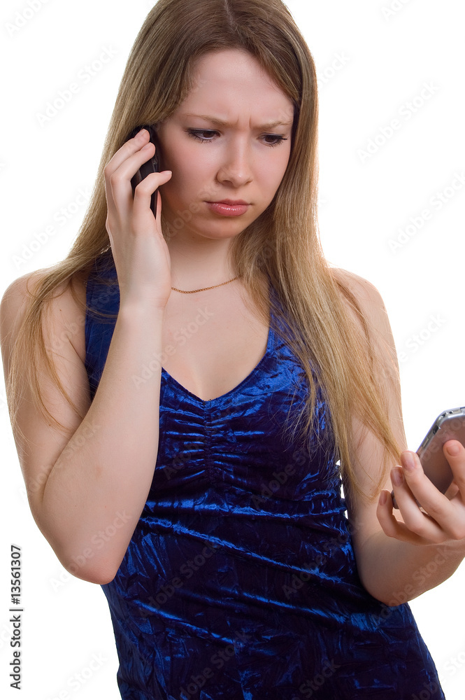 sad girl in blue dress with two cellular phones Stock Photo | Adobe Stock