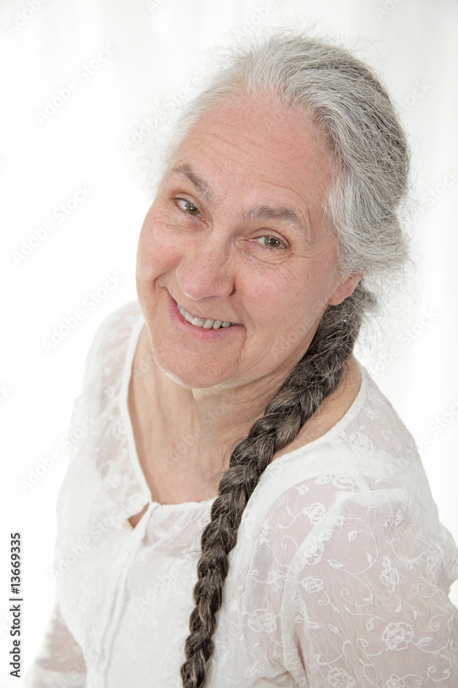 Old lady with long braid Stock Photo | Adobe Stock
