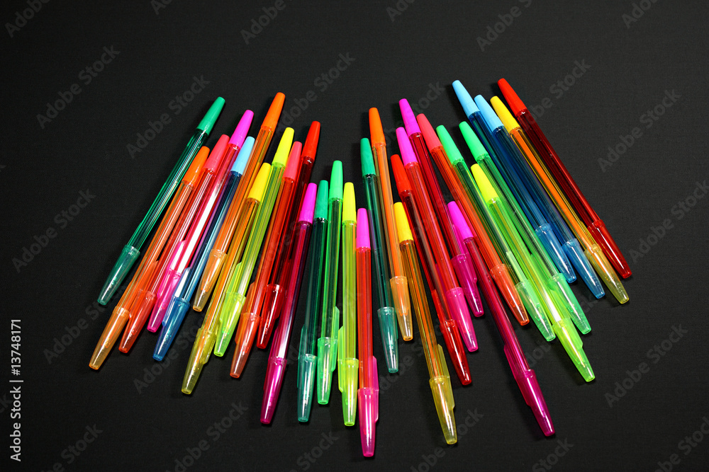 Lots of coloured biros on a black background with copyspace Stock Photo ...