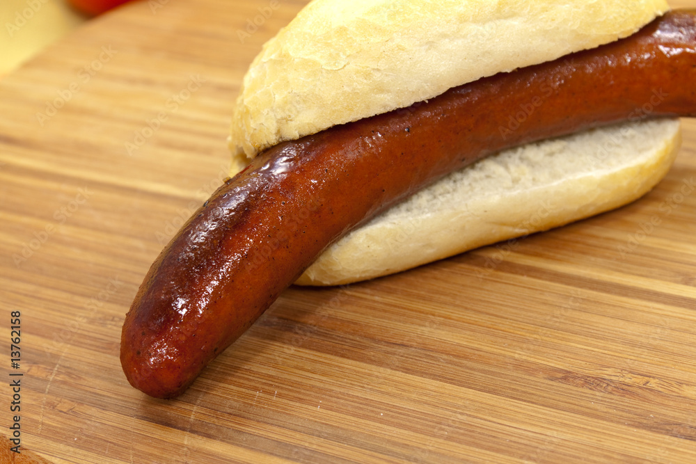 Rote Bratwurst mit Brötchen Stock-Foto | Adobe Stock