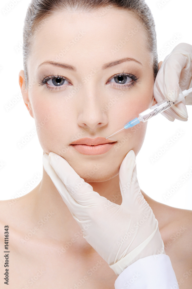 Young woman receiving cosmetic injection Stock Photo | Adobe Stock