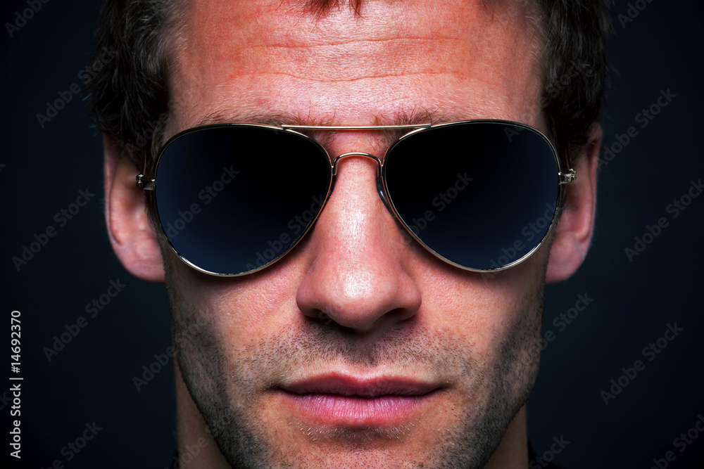 Man wearing aviator sunglasses Stock Photo | Adobe Stock