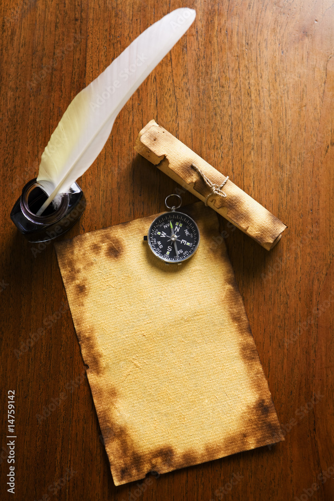 Compass on old paper, with scroll and quill pen Stock Photo | Adobe Stock
