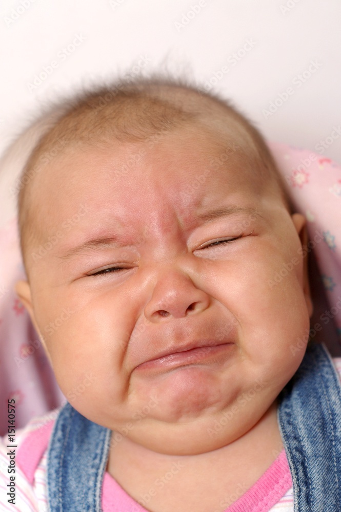 Four month old baby girl crying Stock Photo | Adobe Stock