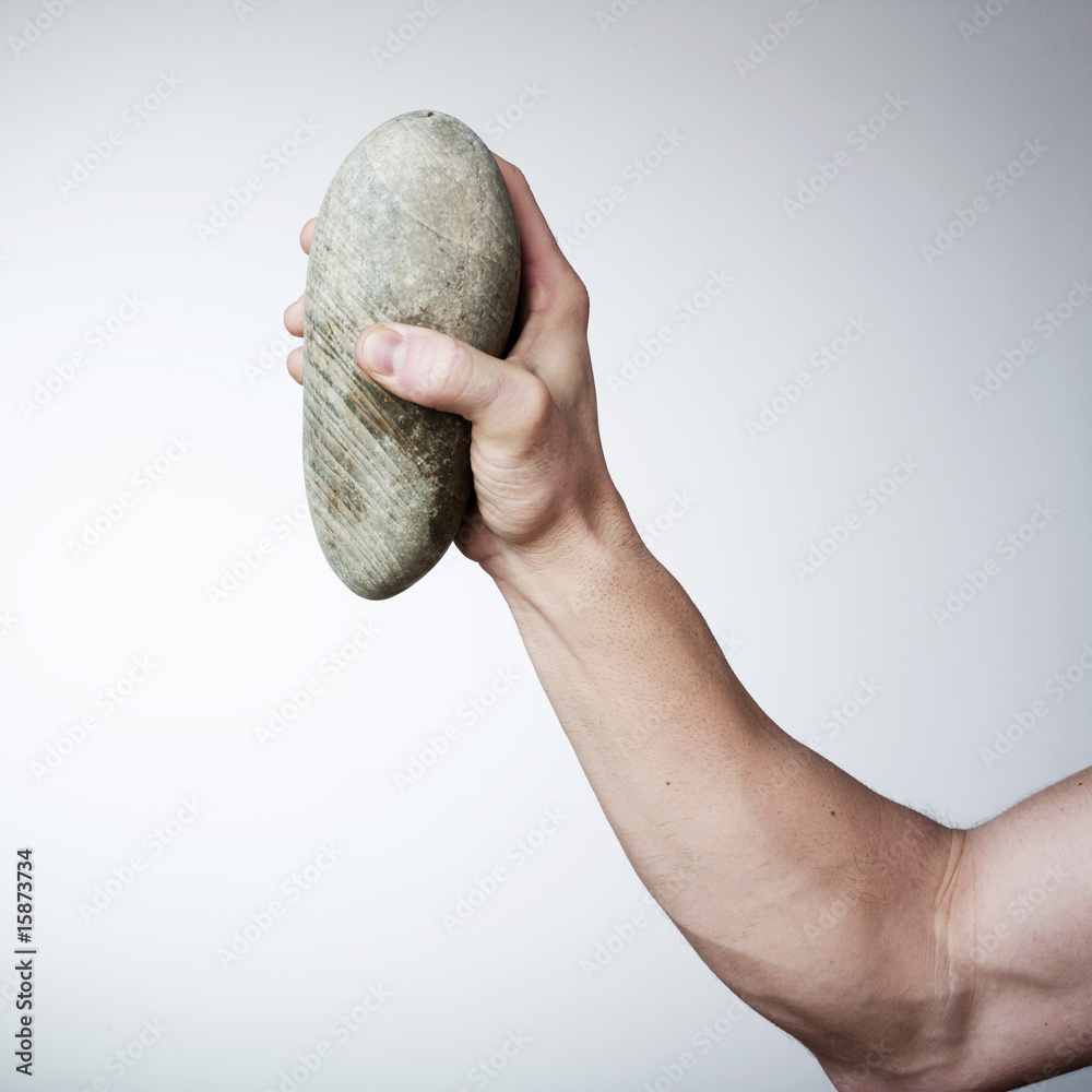 main portant une pierre Stock Photo | Adobe Stock