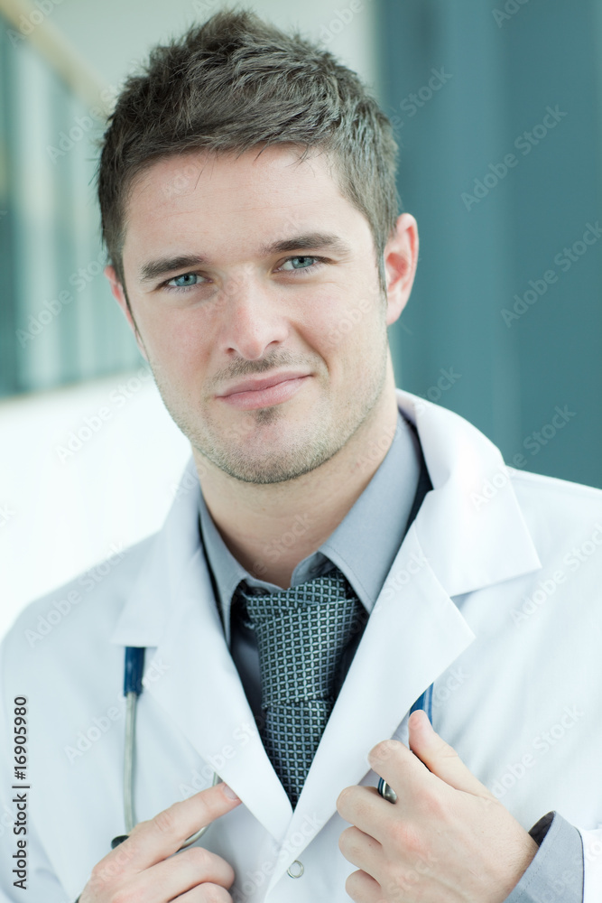 Attractive doctor looking at the camera Stock Photo | Adobe Stock