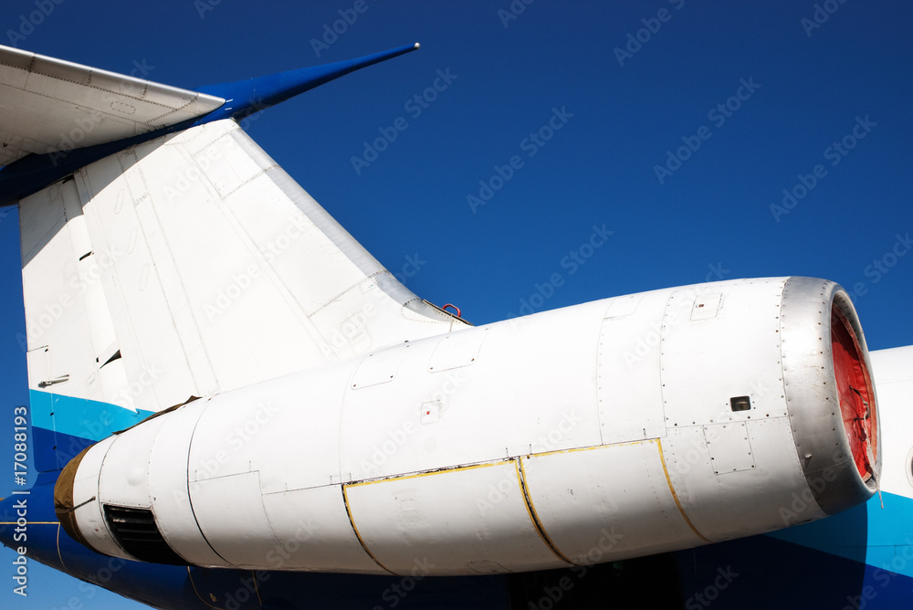 airplane tail jet engine, white and covered against blue sky Stock ...
