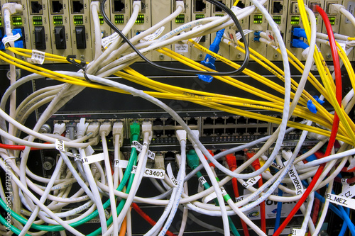 a bunch of patch network cables sorted in a rack cabinet leading from a ... a bunch of patch network cables sorted in a rack cabinet leading from a ...