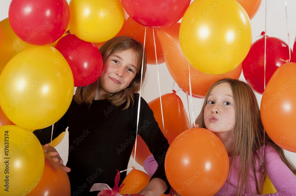 young girls playing in balloons Stock Photo | Adobe Stock