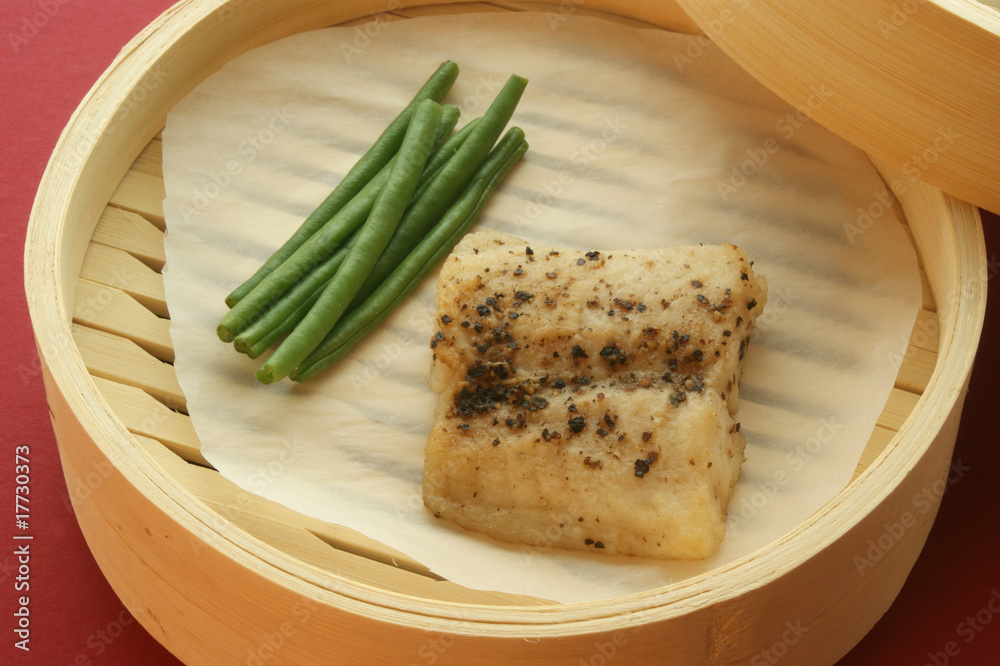 vietnamese river cobbler fillet in a bamboo steamer Stock Photo | Adobe ...