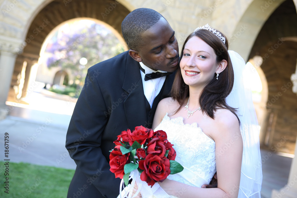 Attractive Interracial Wedding Couple Kissing Stock Photo | Adobe Stock