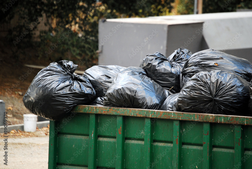 full dumpster Stock Photo | Adobe Stock