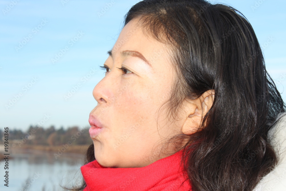 Chinese girl whistling Stock Photo | Adobe Stock