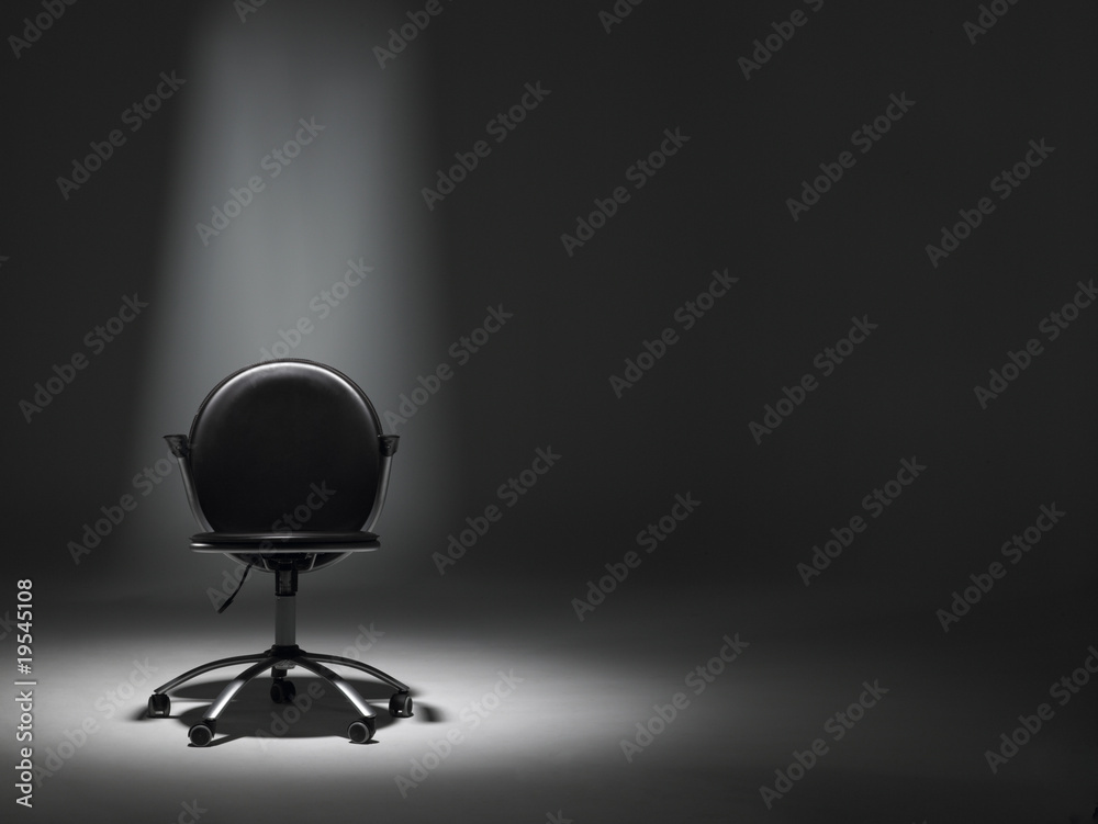 Empty Office Chair In Spotlight Stock Photo | Adobe Stock