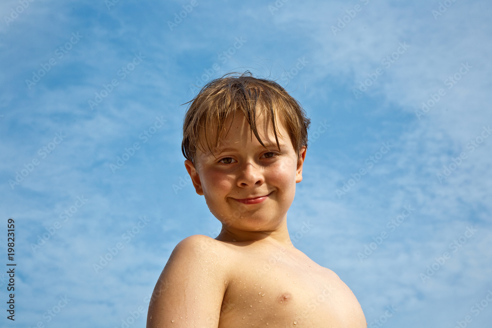 Happy Smiling Young Boy With Brown Hair And Eyes At The Beach Stock