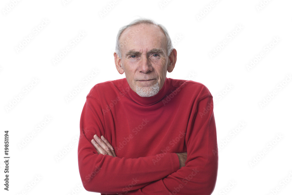 Grumpy old man peering with arms crossed Stock Photo | Adobe Stock