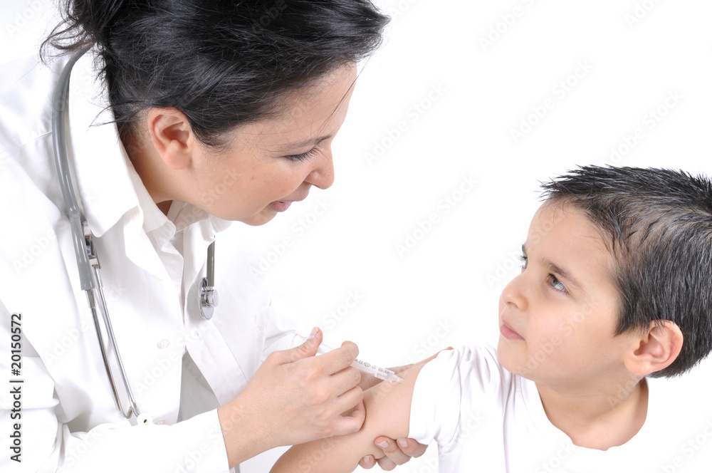 Pediatrician giving an injection in arm to a little boy Stock Photo ...