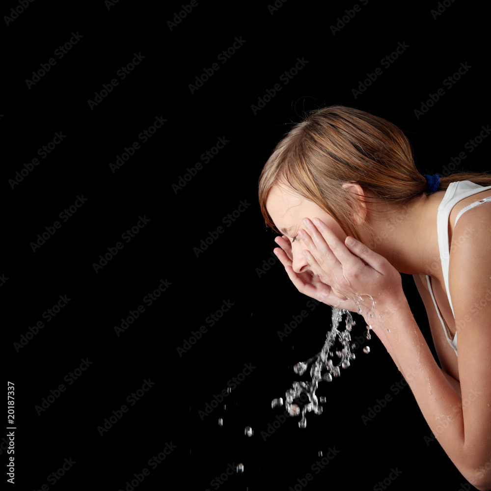 Teen girl washing her face with water Stock Photo | Adobe Stock
