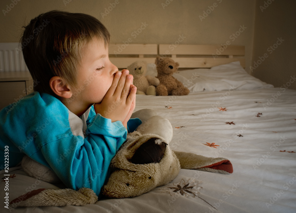 Little boy praying at bedtime Stock Photo | Adobe Stock
