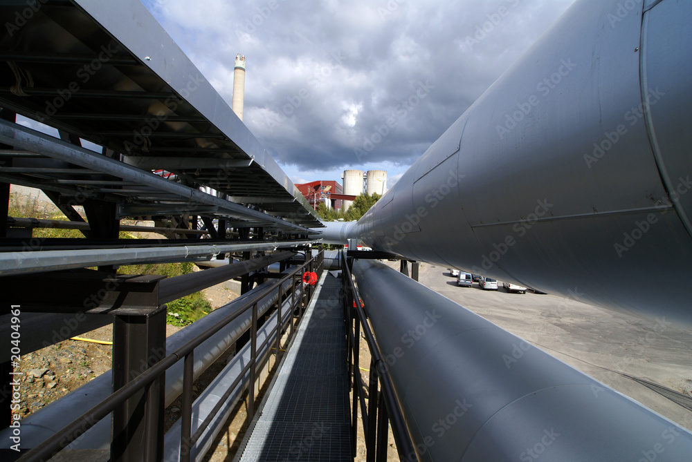Pipes, tubes, machinery and steam turbine at a power plant Stock Photo ...