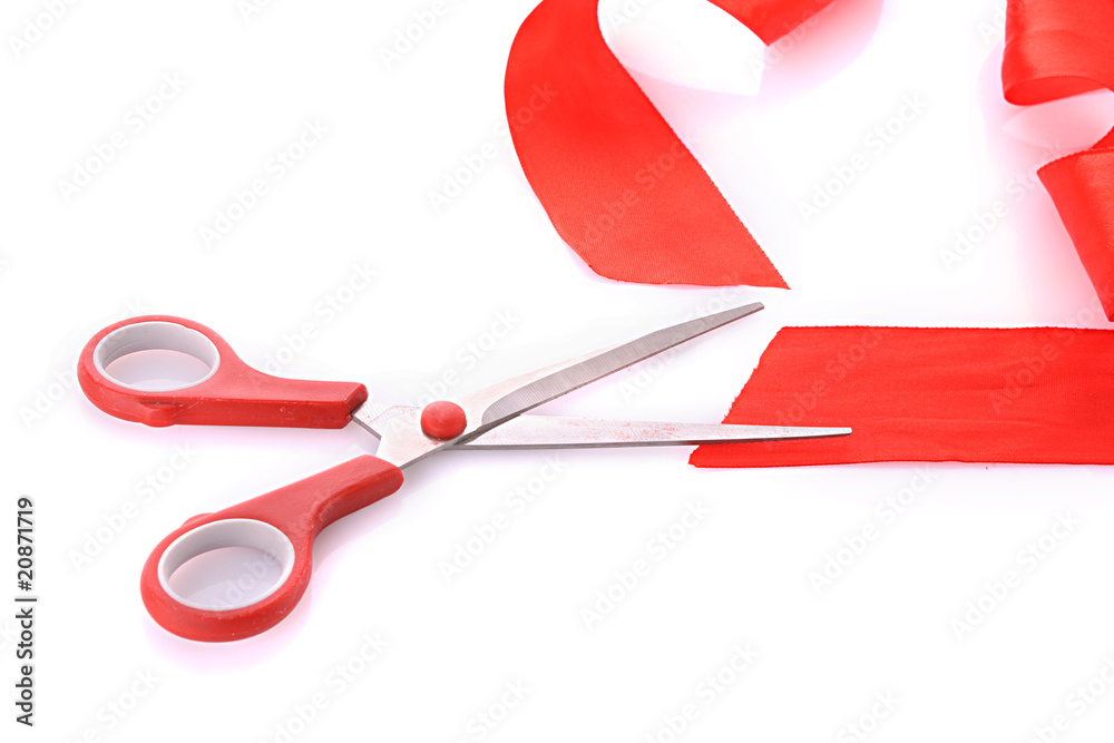 Red ribbon with scissors isolated on white. Stock Photo | Adobe Stock