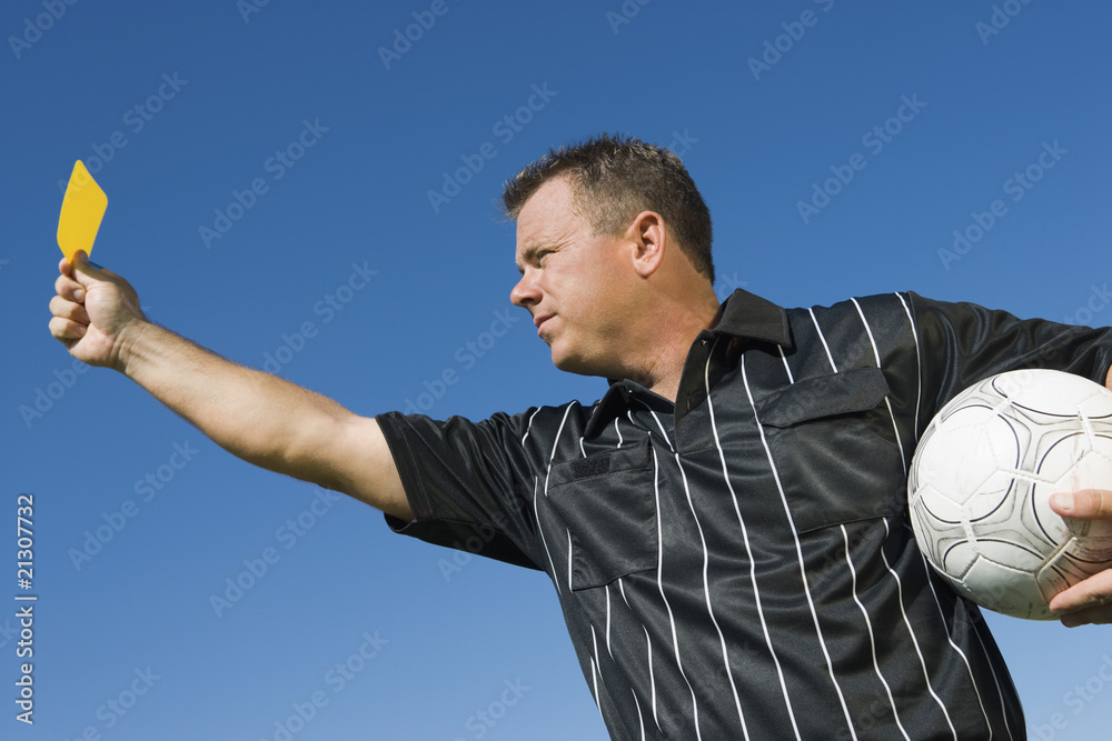 soccer referee holding yellow card portrait Stock Photo | Adobe Stock